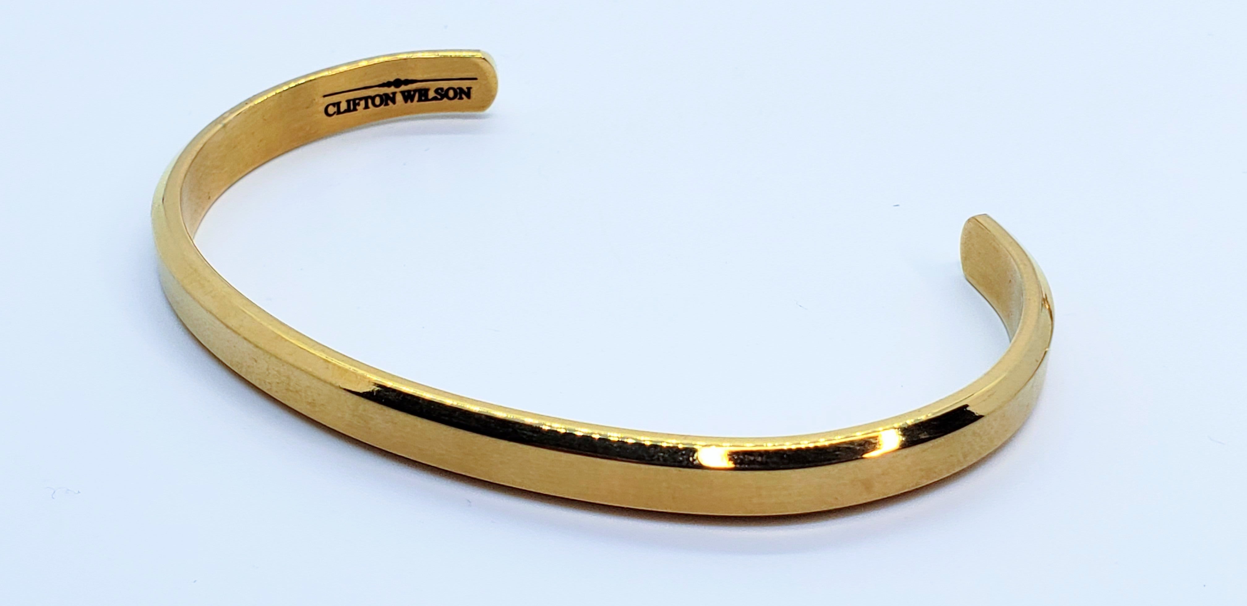 GOLD STAINLESS STEEL BANGLE – Clifton Wilson